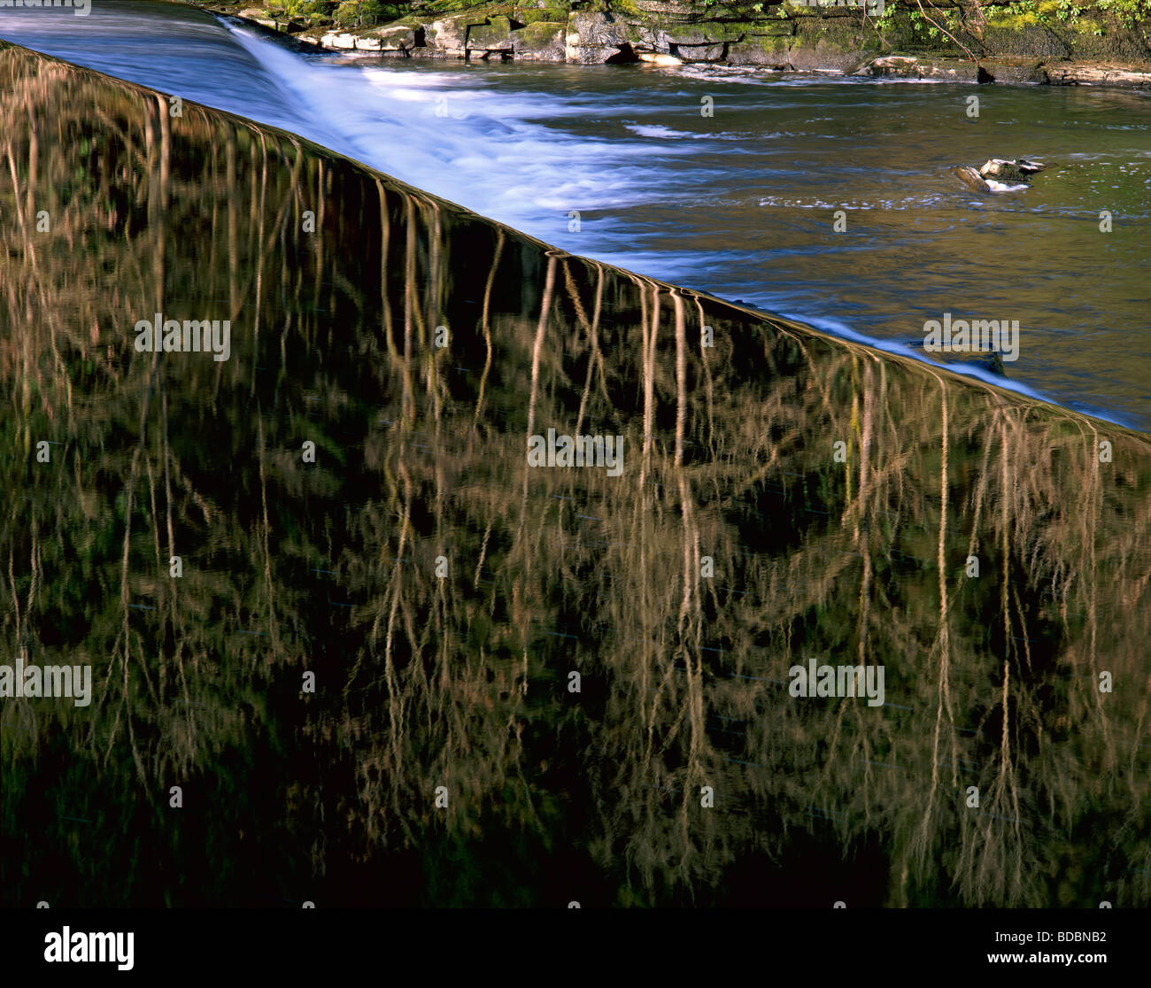 A weir on the River Clyde at New Lanark Heritage Village, South ...