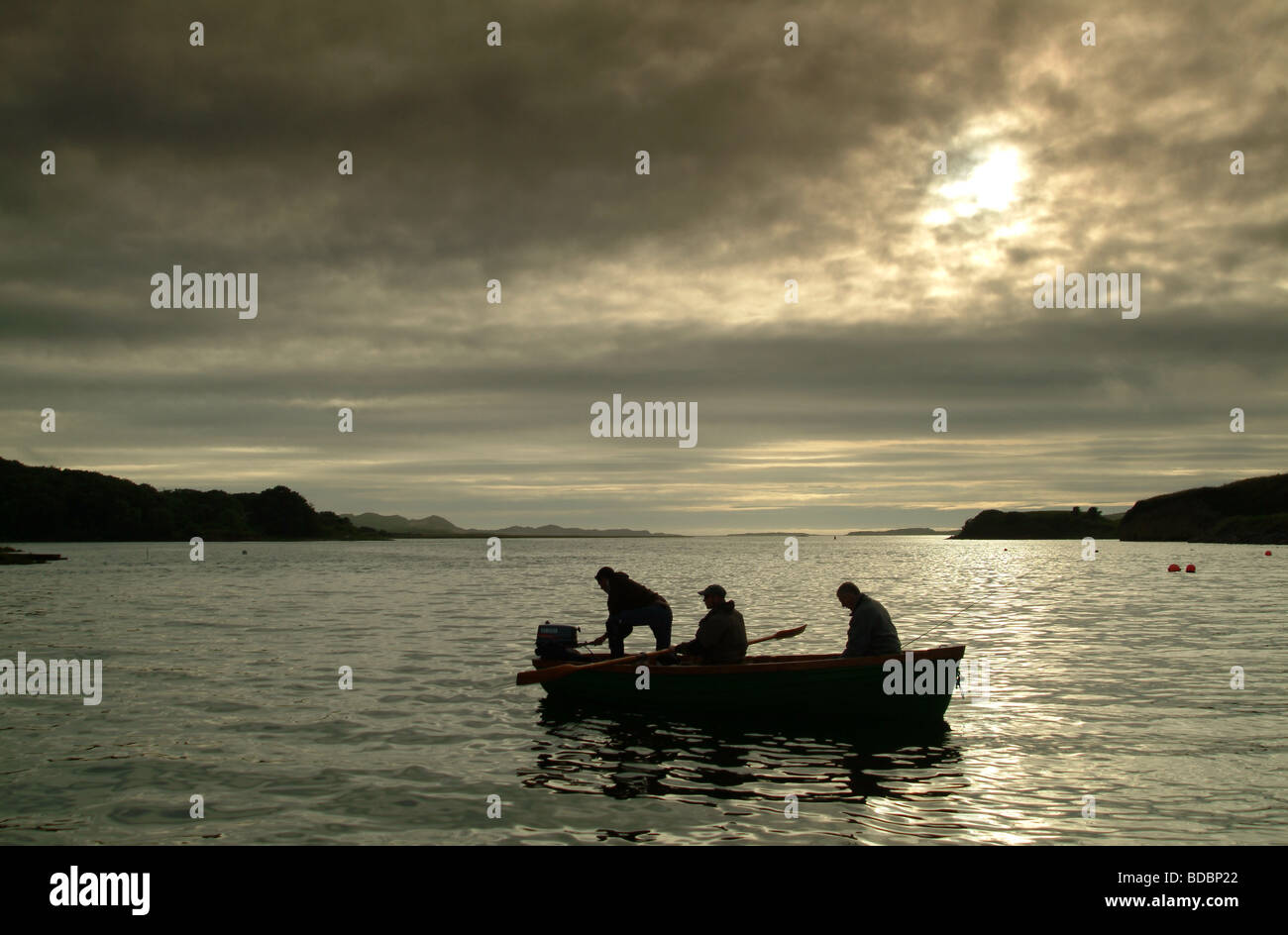 3 men in a boat Stock Photo - Alamy