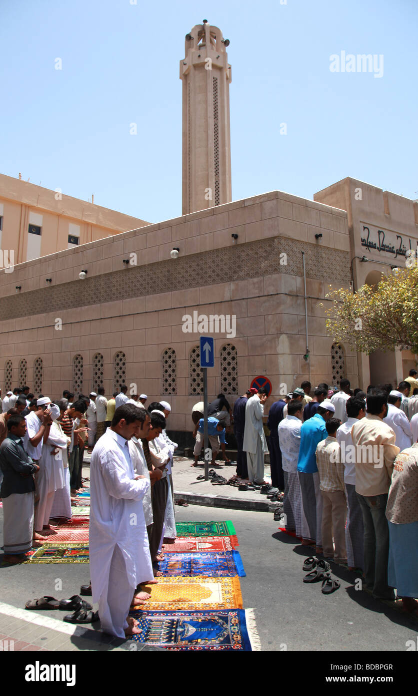 Call for prayer in Dubai. Hundreds of men praying in the streets ...