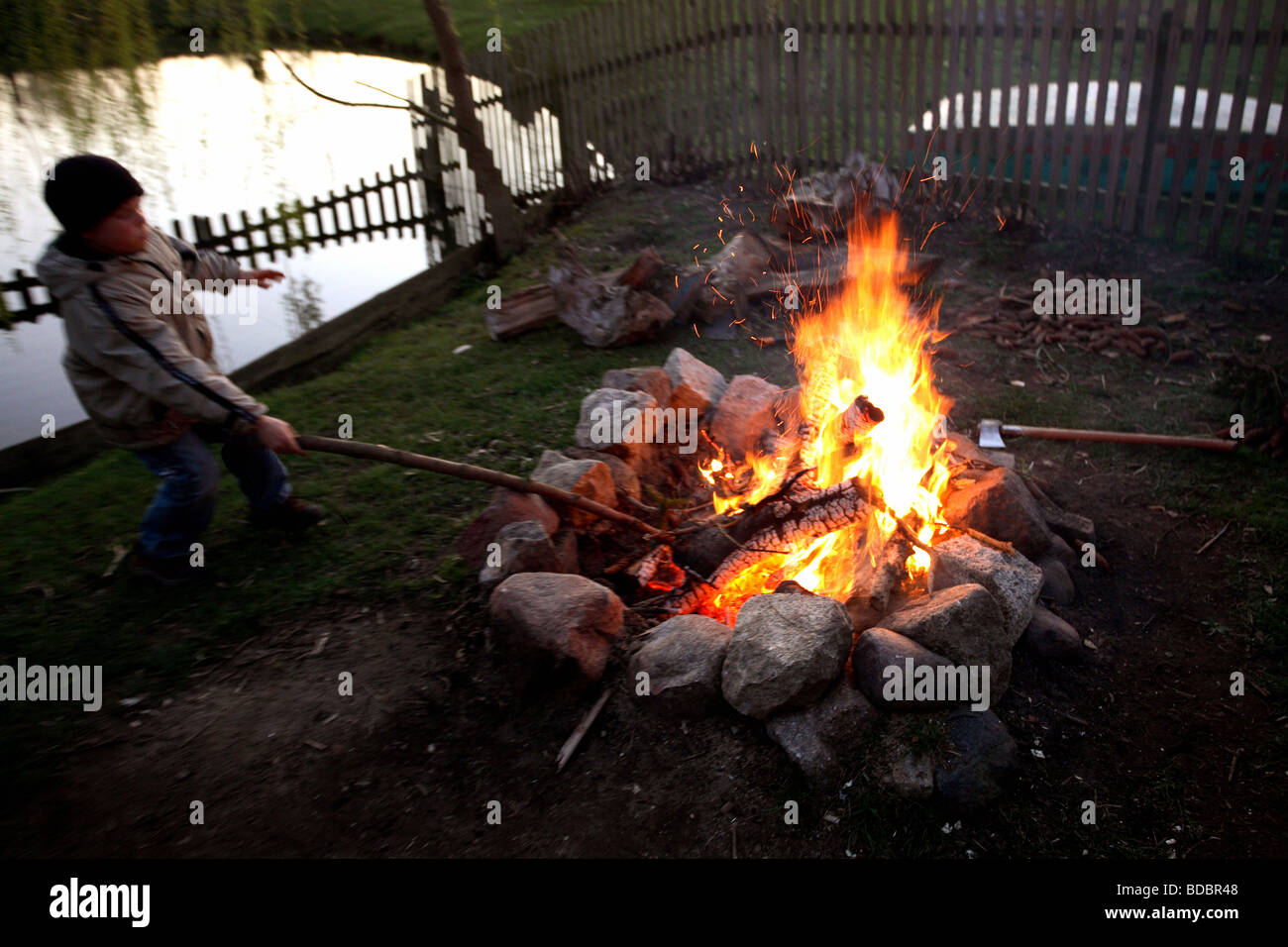 A boy at a bonfire, Prangendorf, Germany Stock Photo - Alamy