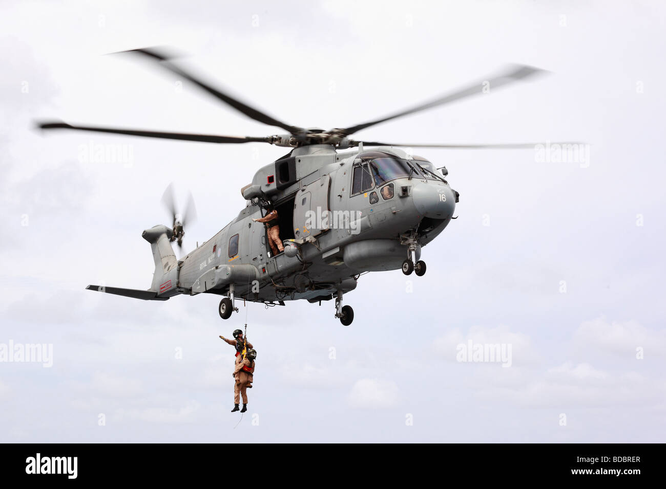 Merlin helicopter winching off of HMS BULWARK Stock Photo - Alamy