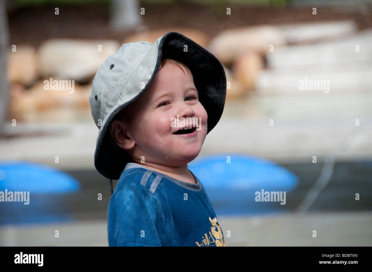 Smiling boy at the water park at Southbank Parkland, Brisbane ...