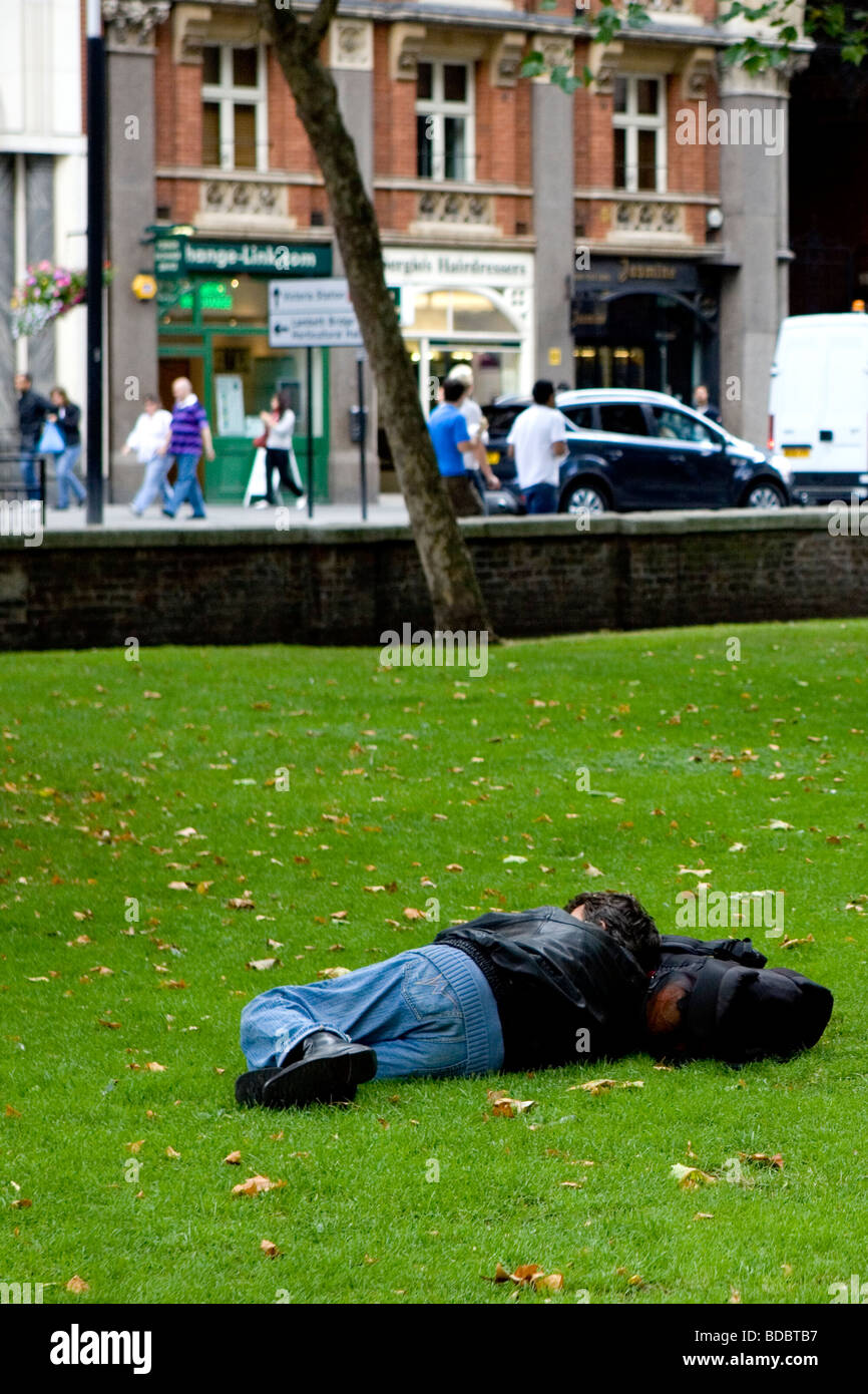 Man Sleeping in Park Stock Photo - Alamy