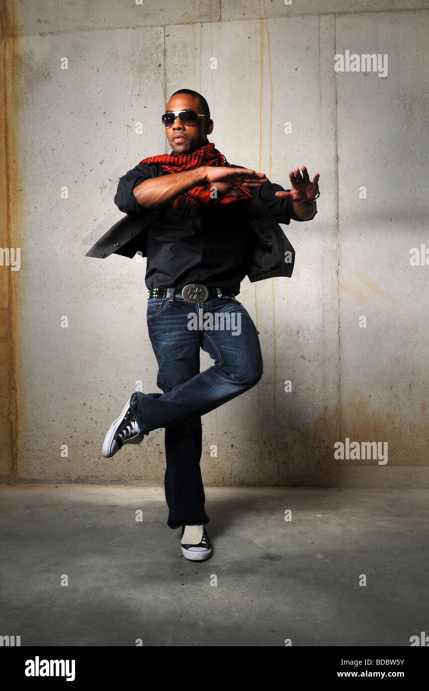 African American hip hop dancer performing over a grunge background ...