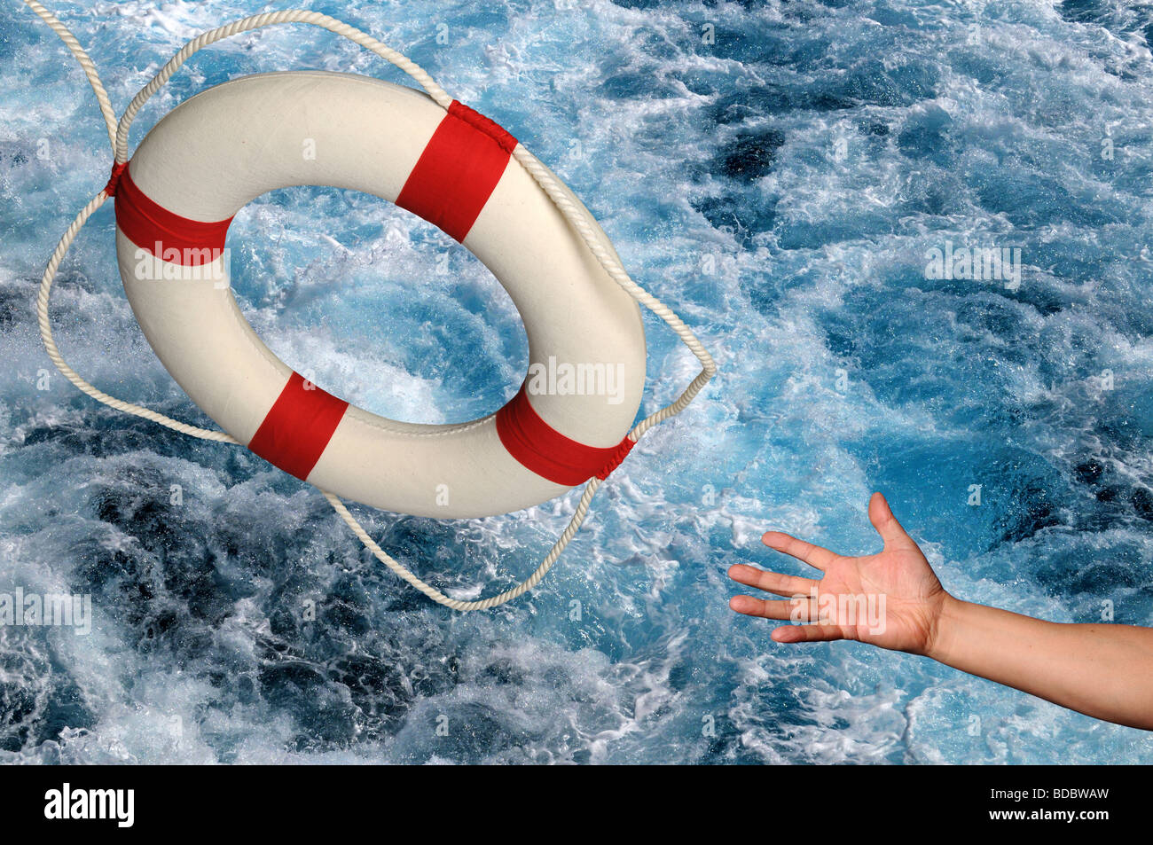 Hand reaching for life ring over churning waters Stock Photo - Alamy