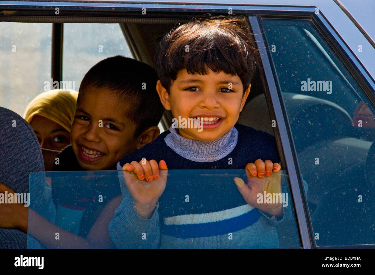 Children in a car Sultanate of Oman Stock Photo - Alamy