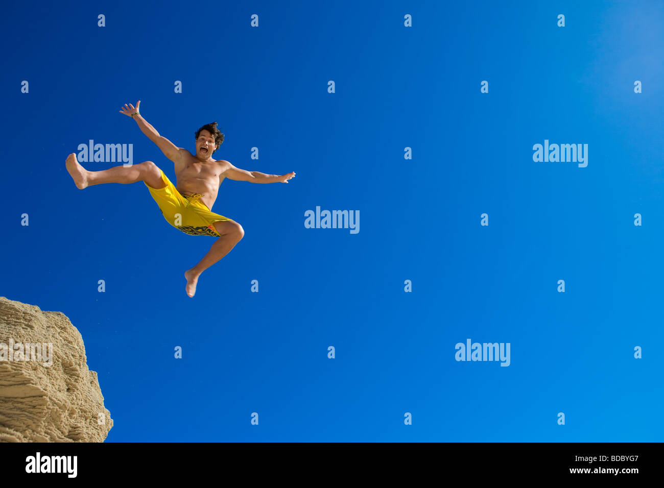 Young Man Jumping Stock Photo - Alamy