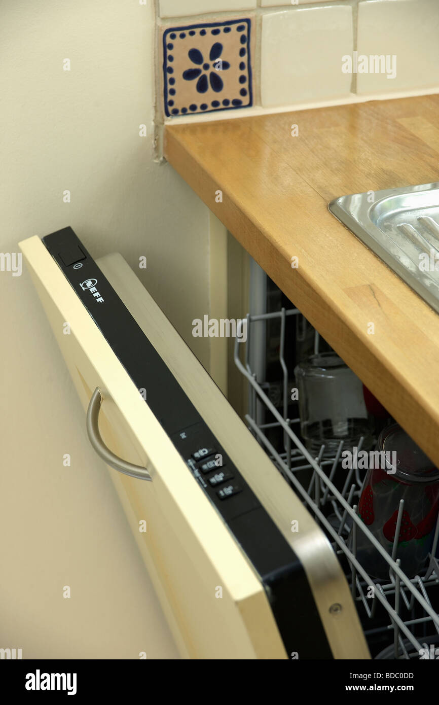 Close up of open dishwasher Stock Photo - Alamy