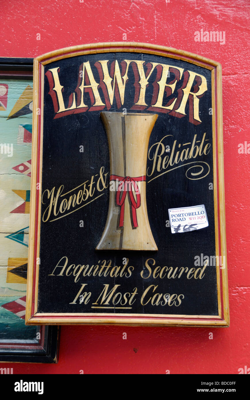 Old hand painted wooden sign advertising the services of a lawyer Stock ...