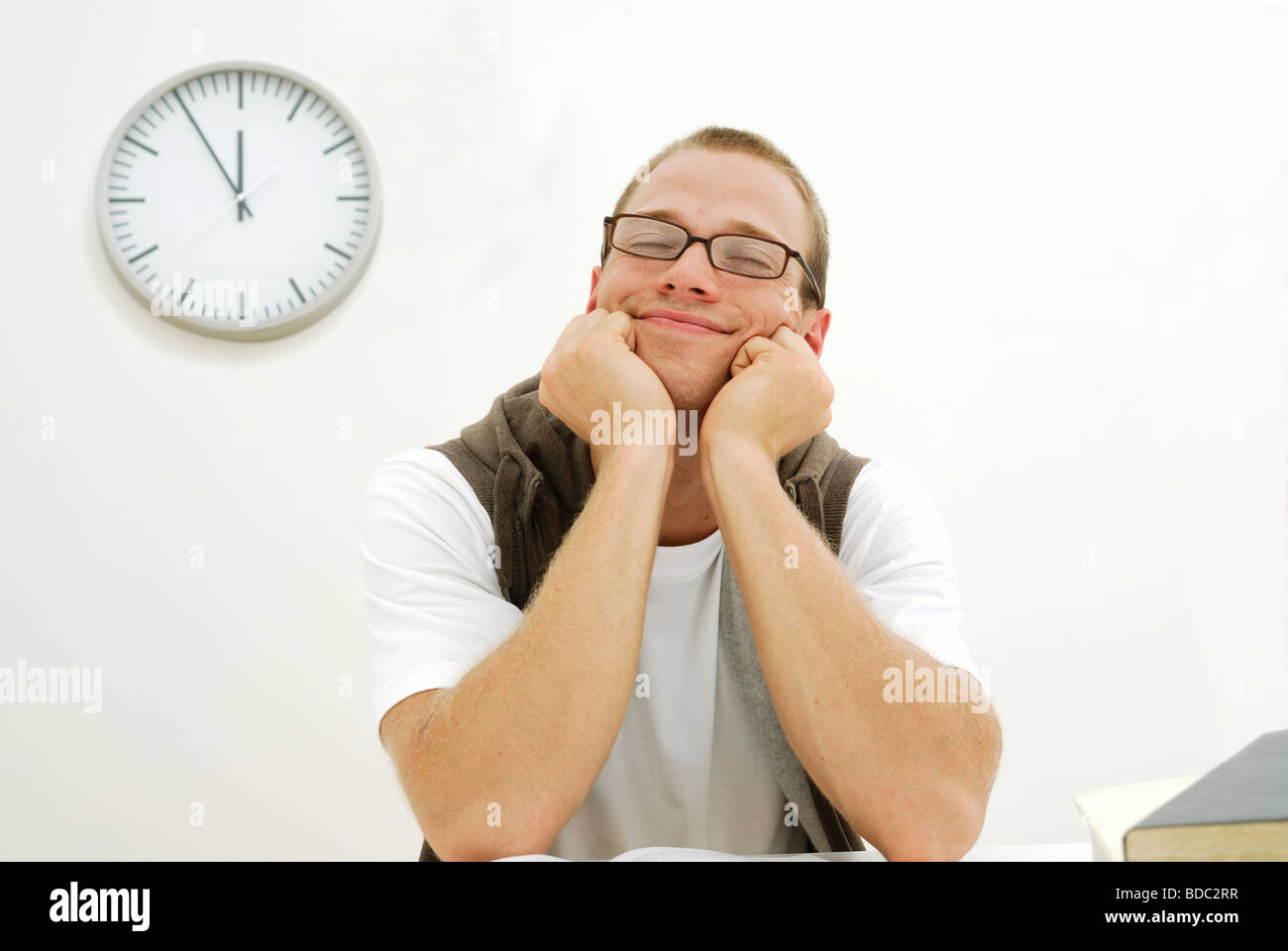 young daydreaming student at his desk Stock Photo - Alamy