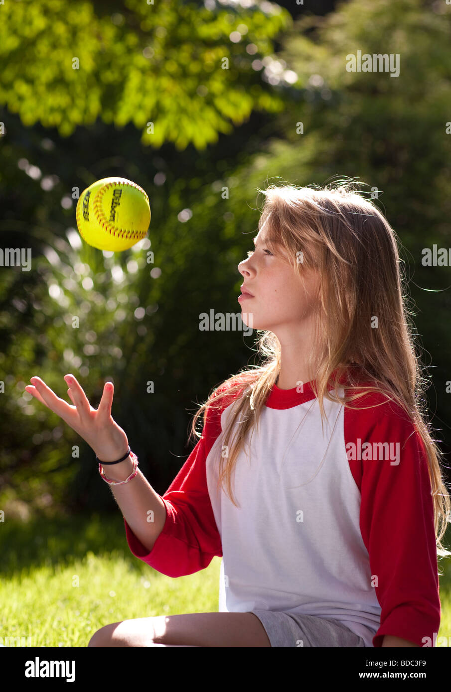 Child tossing ball air hi-res stock photography and images - Alamy