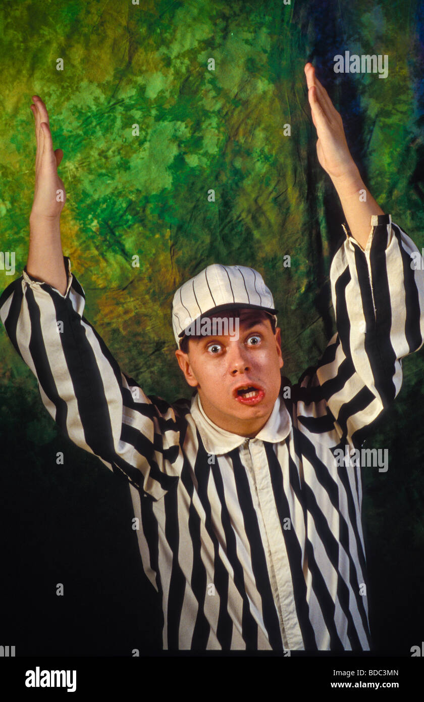 Young sport umpire referee signals scoring touchdown. excitement yell ...