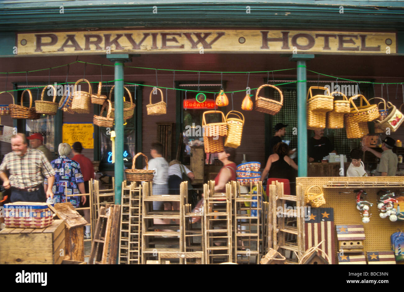 Front porch small town country store hotel with hand crafted baskets ...