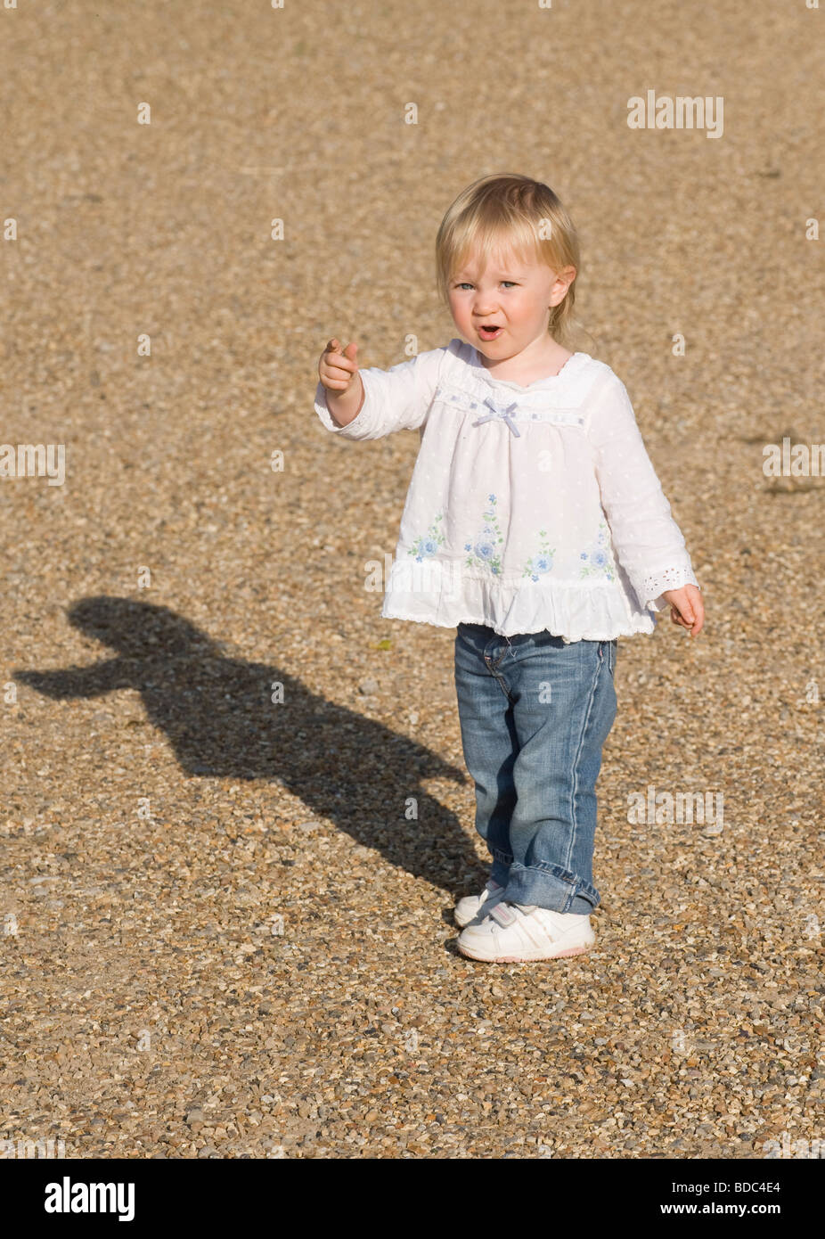 Baby girl 21 months old, on gravel path Stock Photo - Alamy