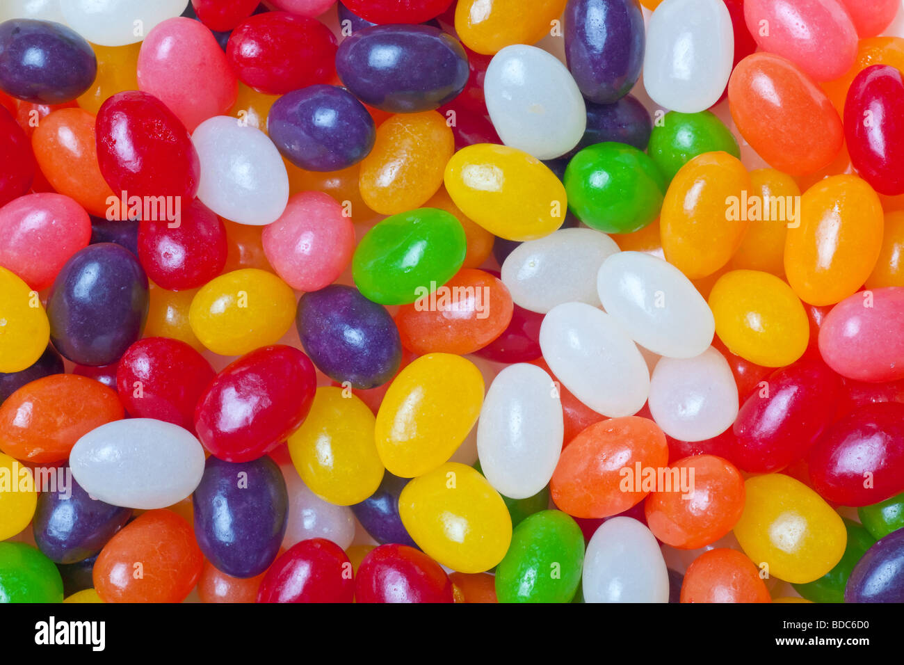 jelly beans multi colored backdrop or background Stock Photo - Alamy
