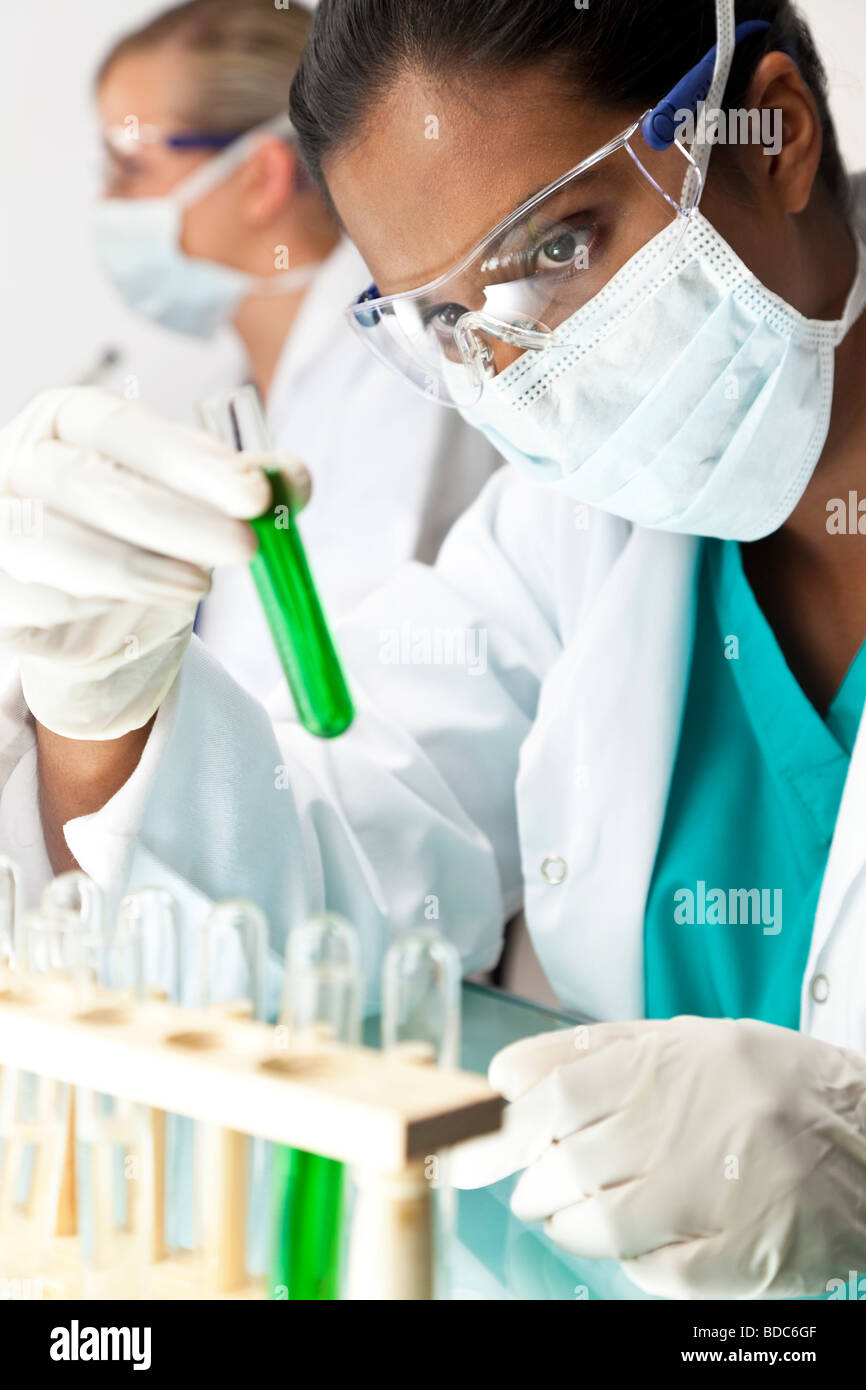 An Asian medical or scientific researcher or doctor using looking at a ...