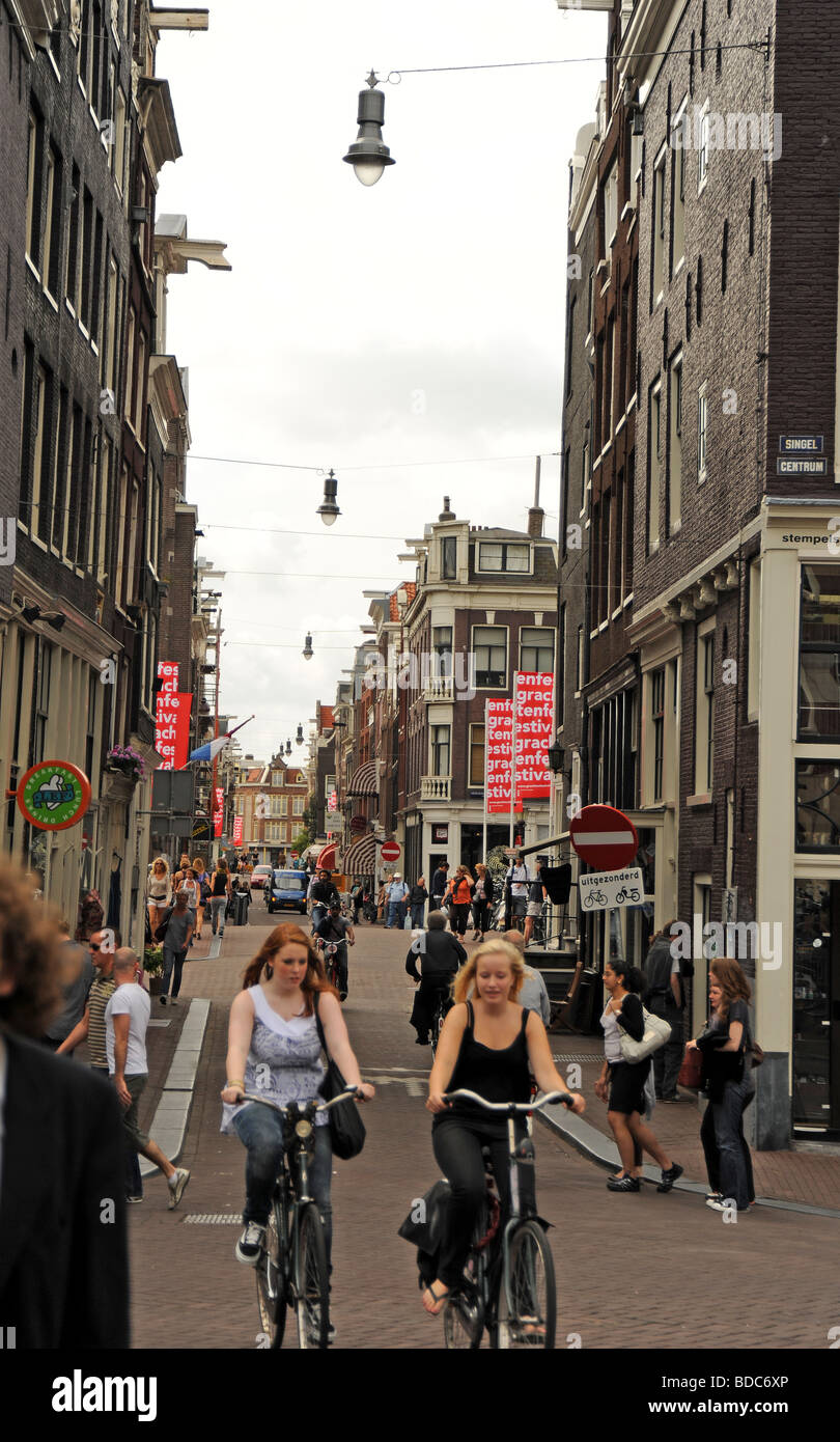 people riding bike in amsterdam Stock Photo - Alamy