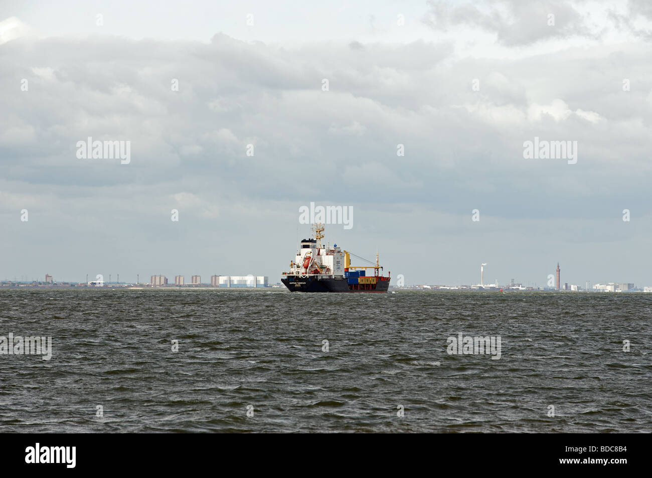 Cargo ship heading up the river Humber towards Grimsby off Spurn Point ...