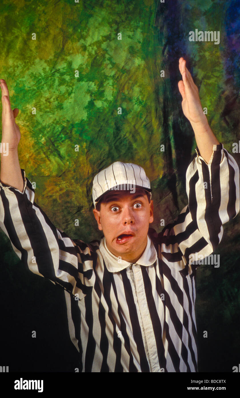 Young sport umpire referee signals scoring touchdown. excitement yell ...