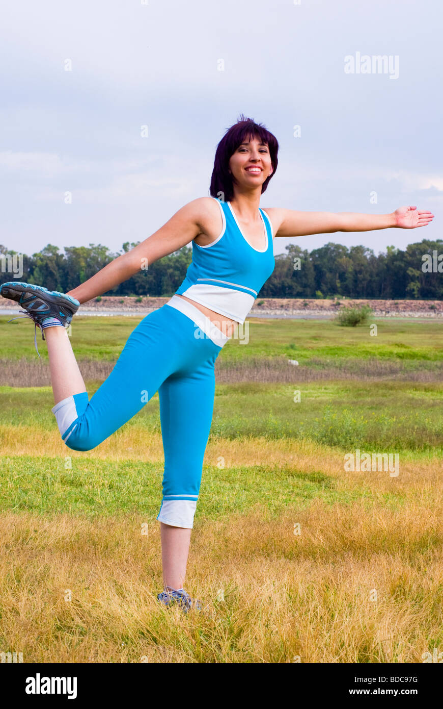 Active woman exercising in a park outdoors Stock Photo - Alamy