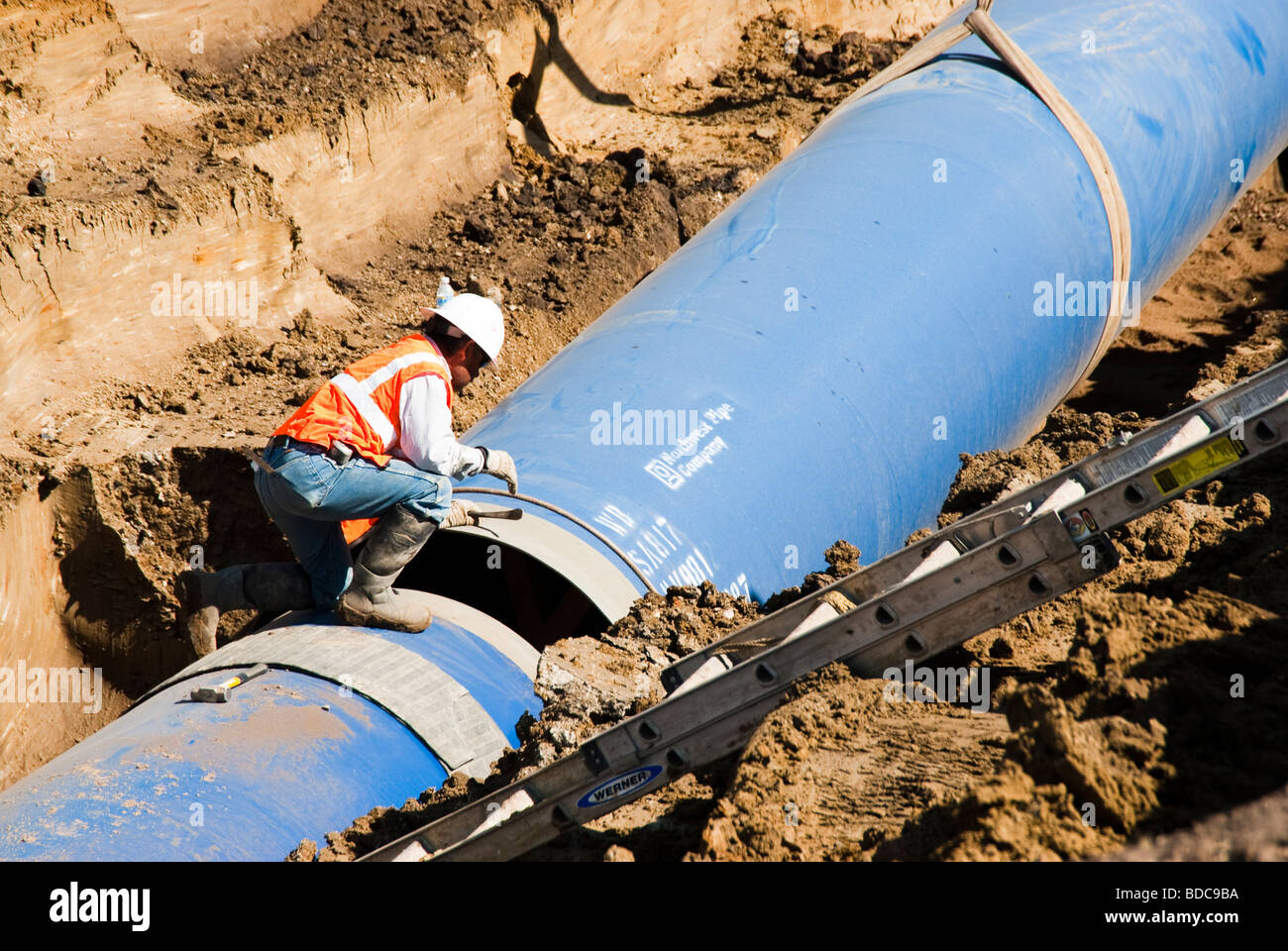 Water pipe being laid at the Louis Clark Regional Water System pipeline ...