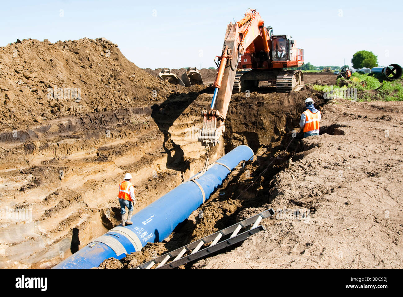 Water pipe being laid at the Louis Clark Regional Water System pipeline ...