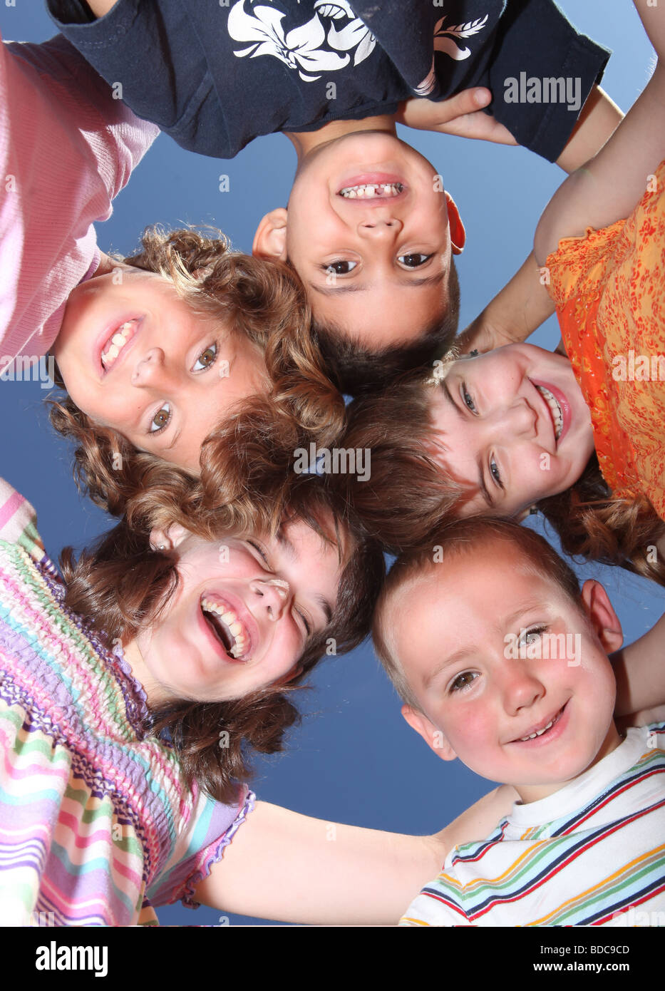 Group of Five Silly Friends Huddles and Laughing Outside Stock Photo ...