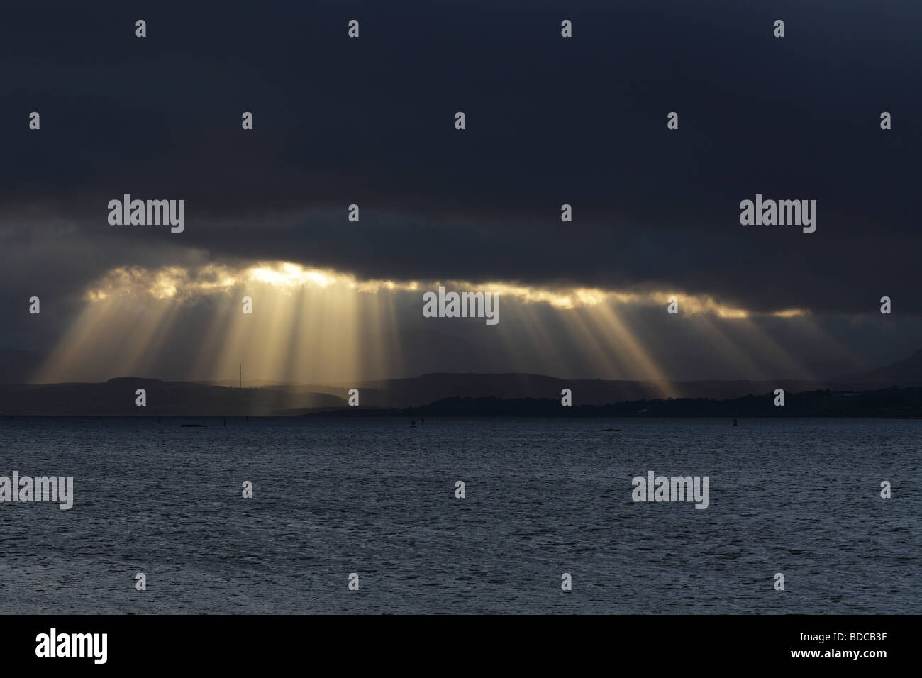 Sun shining through storm cloud hi-res stock photography and images - Alamy
