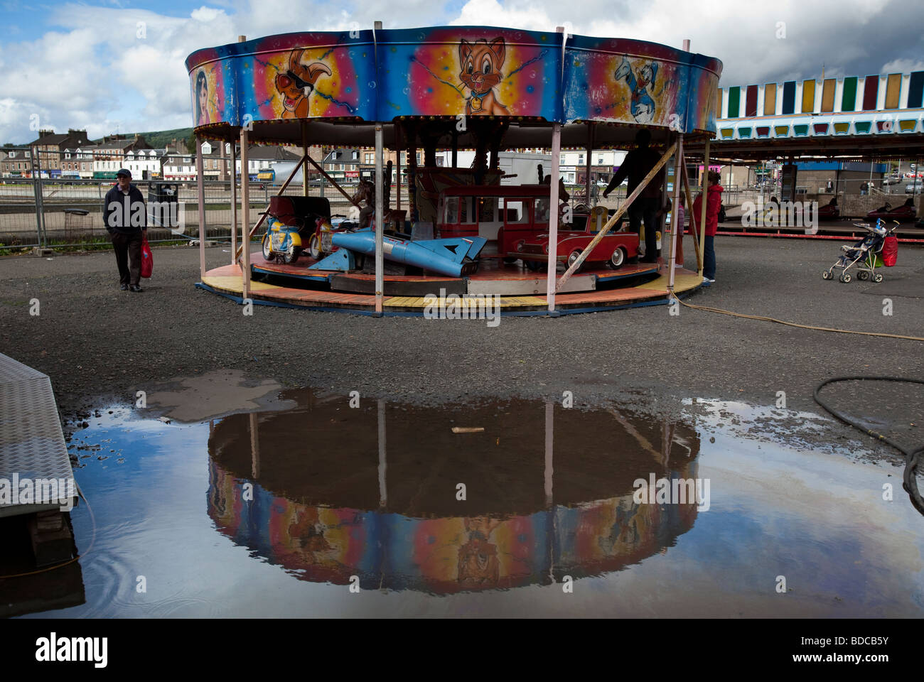 A roundabout on a run down fun fair site in the Scottish town of ...