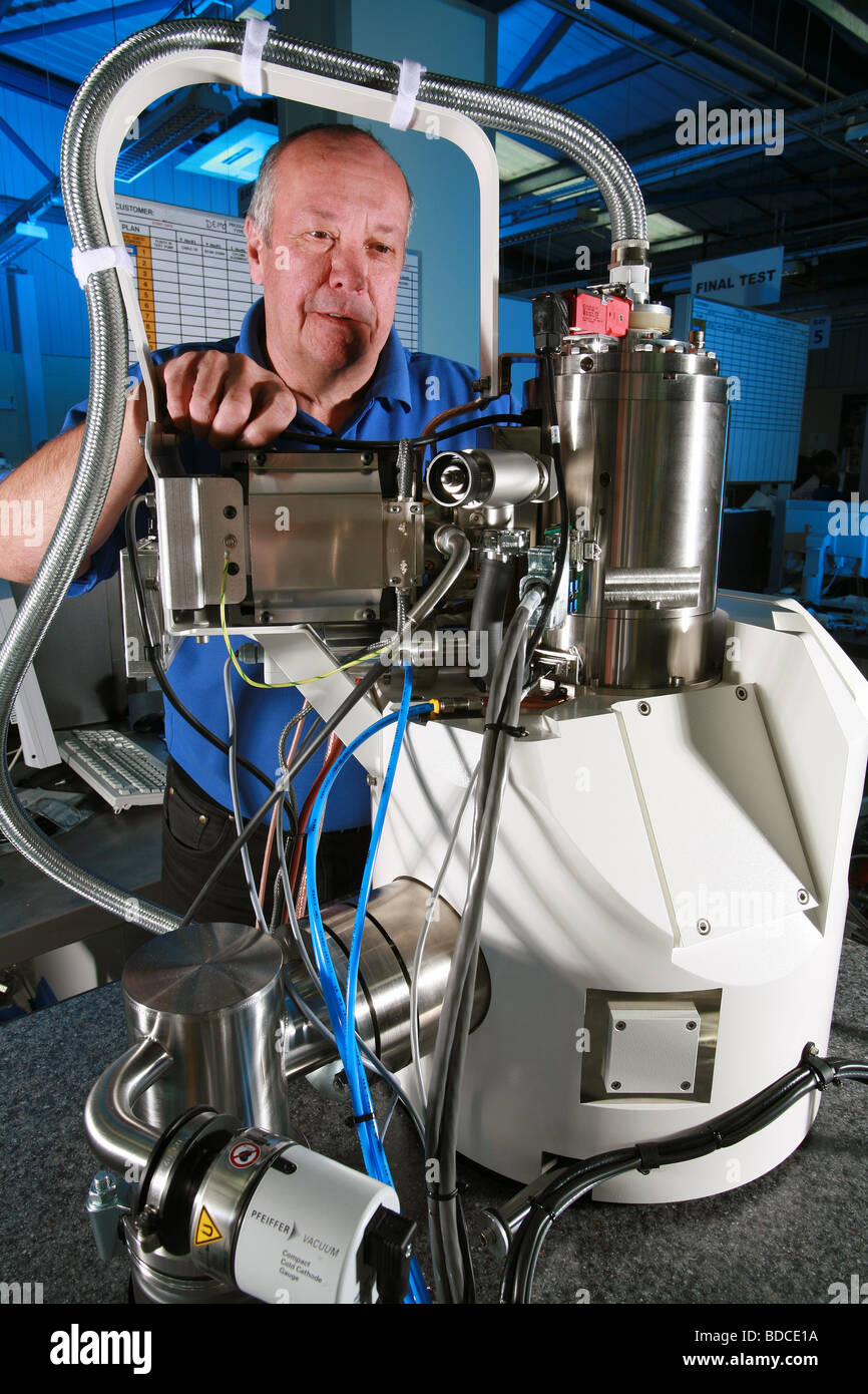 Electronics engineer working in a factory Stock Photo - Alamy