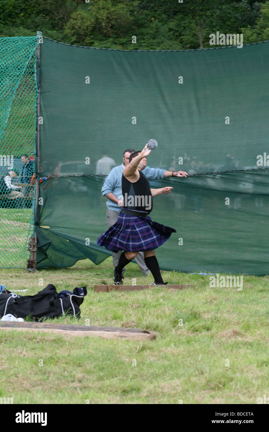 man competing at stone put at Cortachy 2009 highland games scotland ...