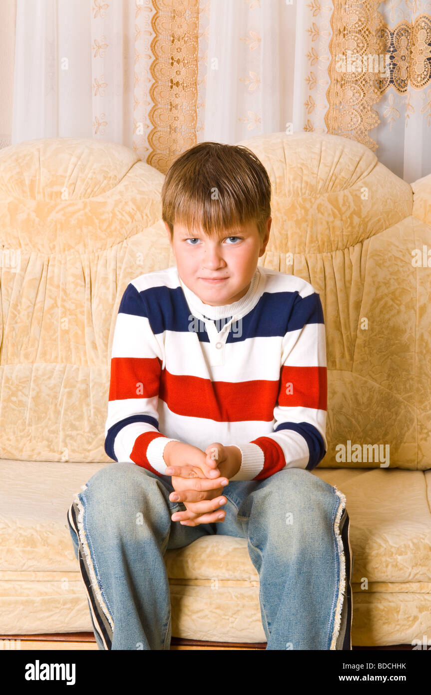boy sitting. isolated on white Stock Photo - Alamy