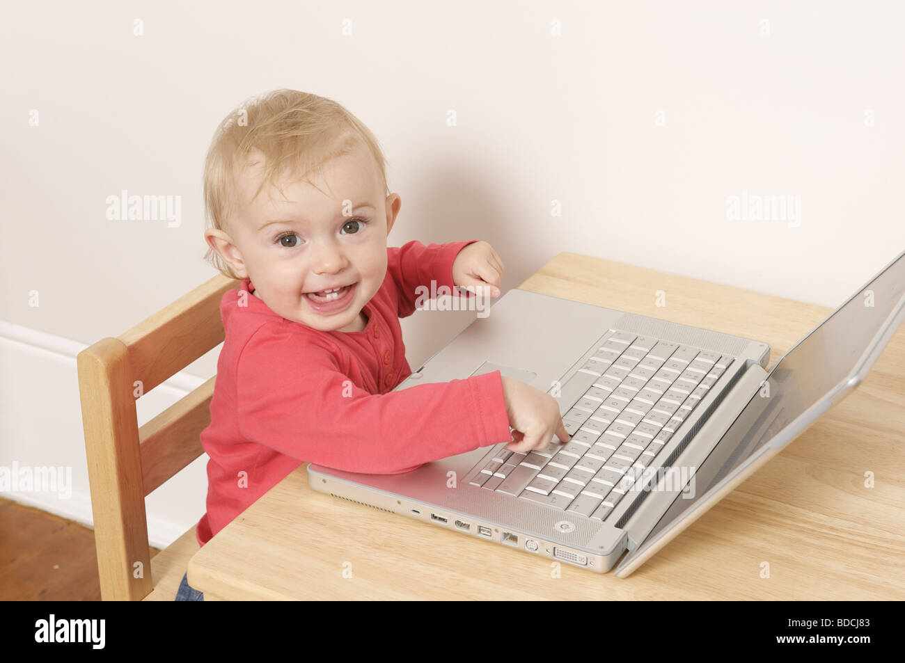 Baby at computer Stock Photo - Alamy