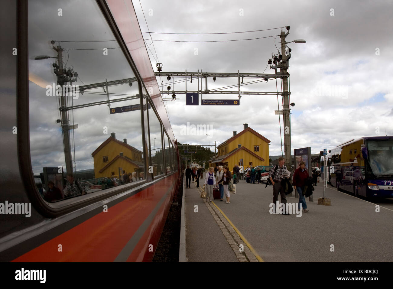 Platform and station building reflected at Geilo train station, Geilo ...