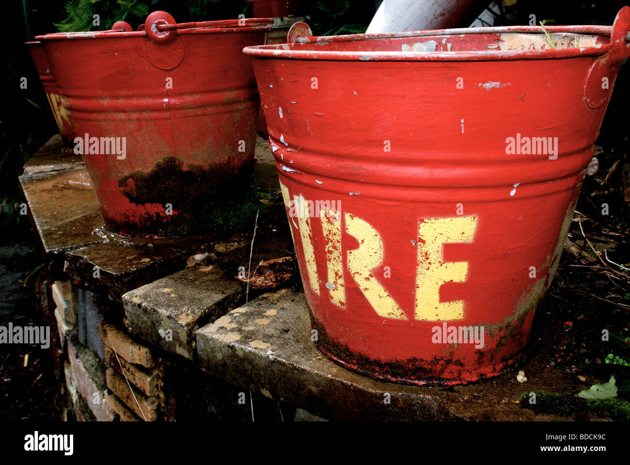 red fire buckets Stock Photo - Alamy
