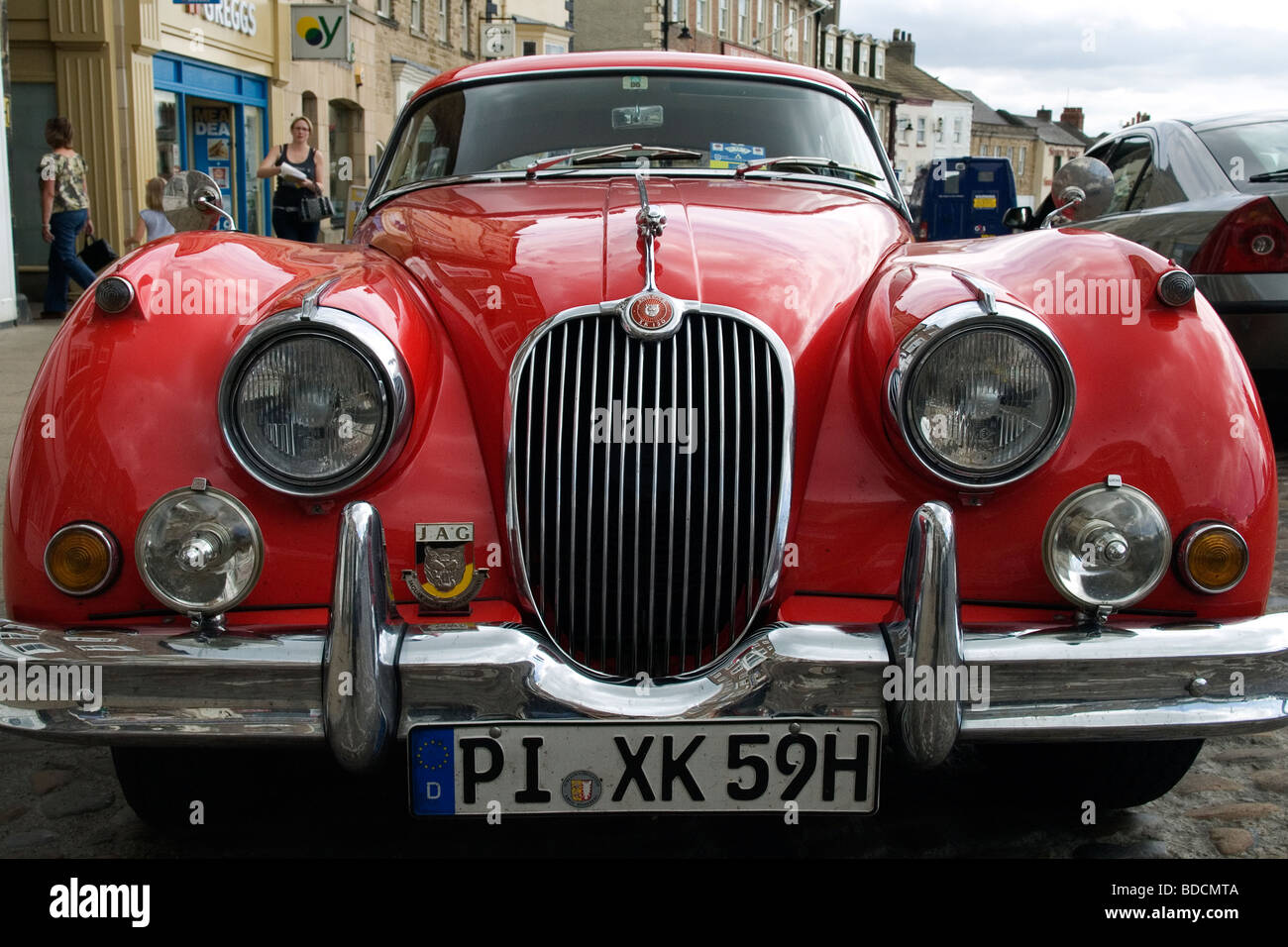 A red German registered Jaguar XK150 sports car parked in Richmond Nort ...