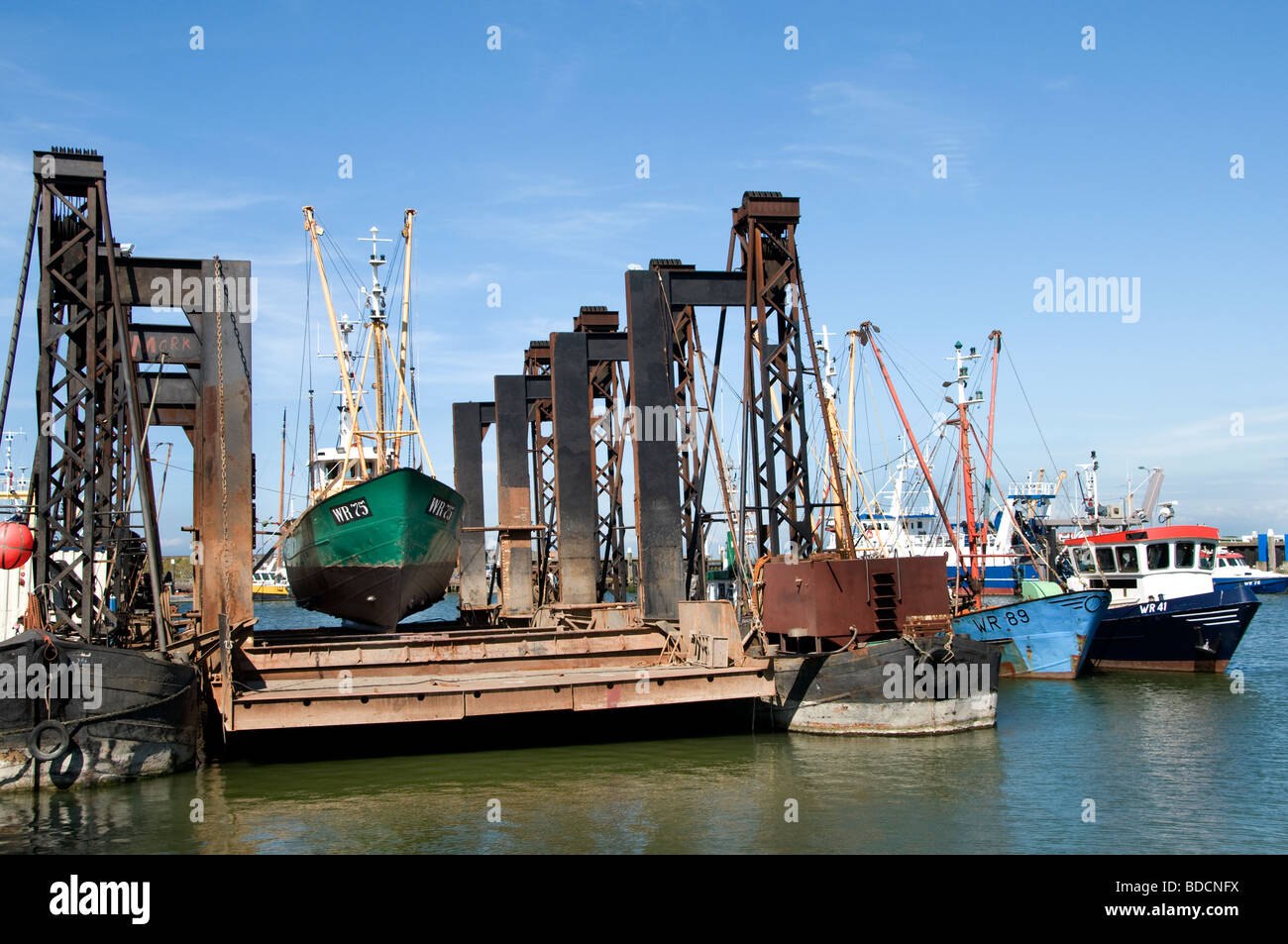 Den Oever Netherlands fishing trawler floating dry dock shipyard port ...