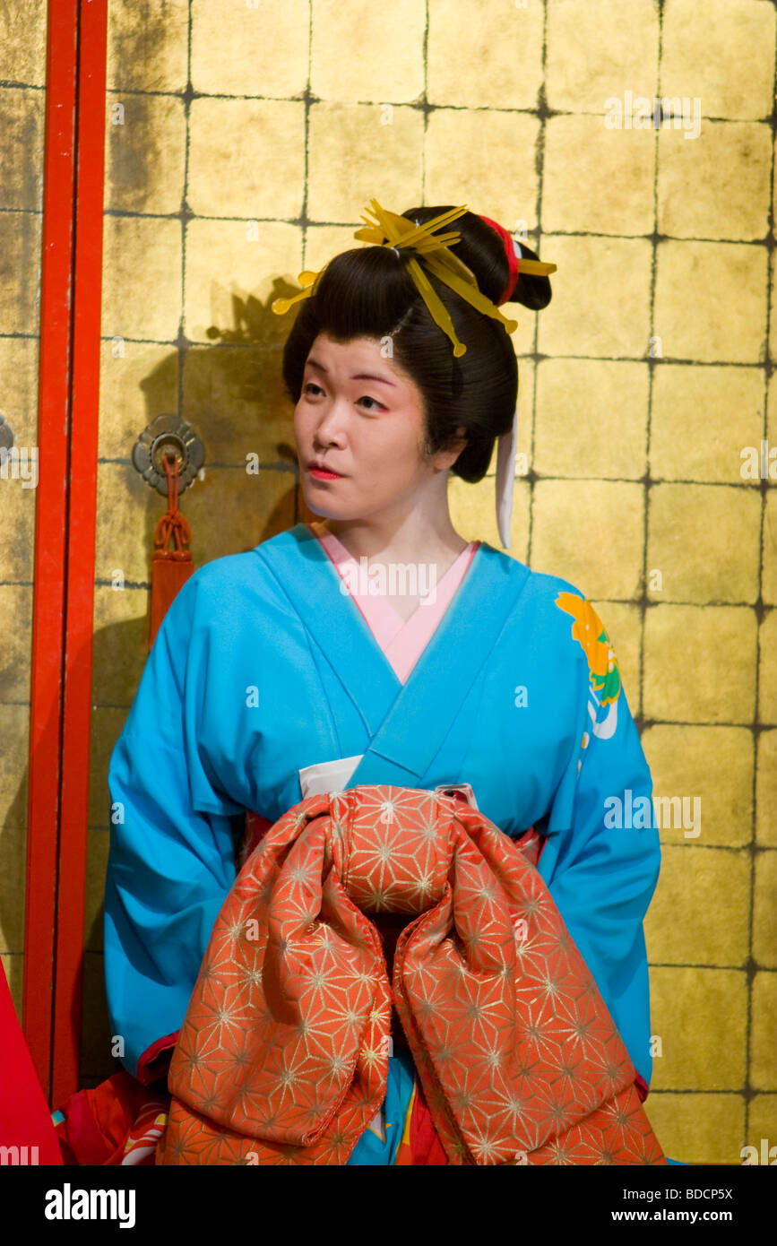 A female performer dressed in traditional geisha outfit performs on ...