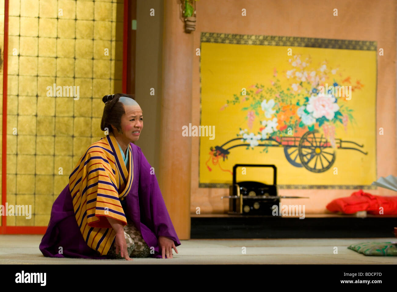 A female performer dressed in traditional geisha outfit performs on ...