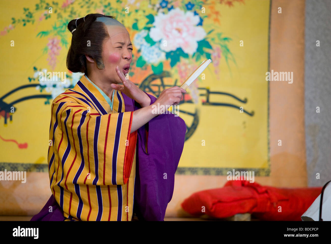 A female performer dressed in traditional geisha outfit performs on ...