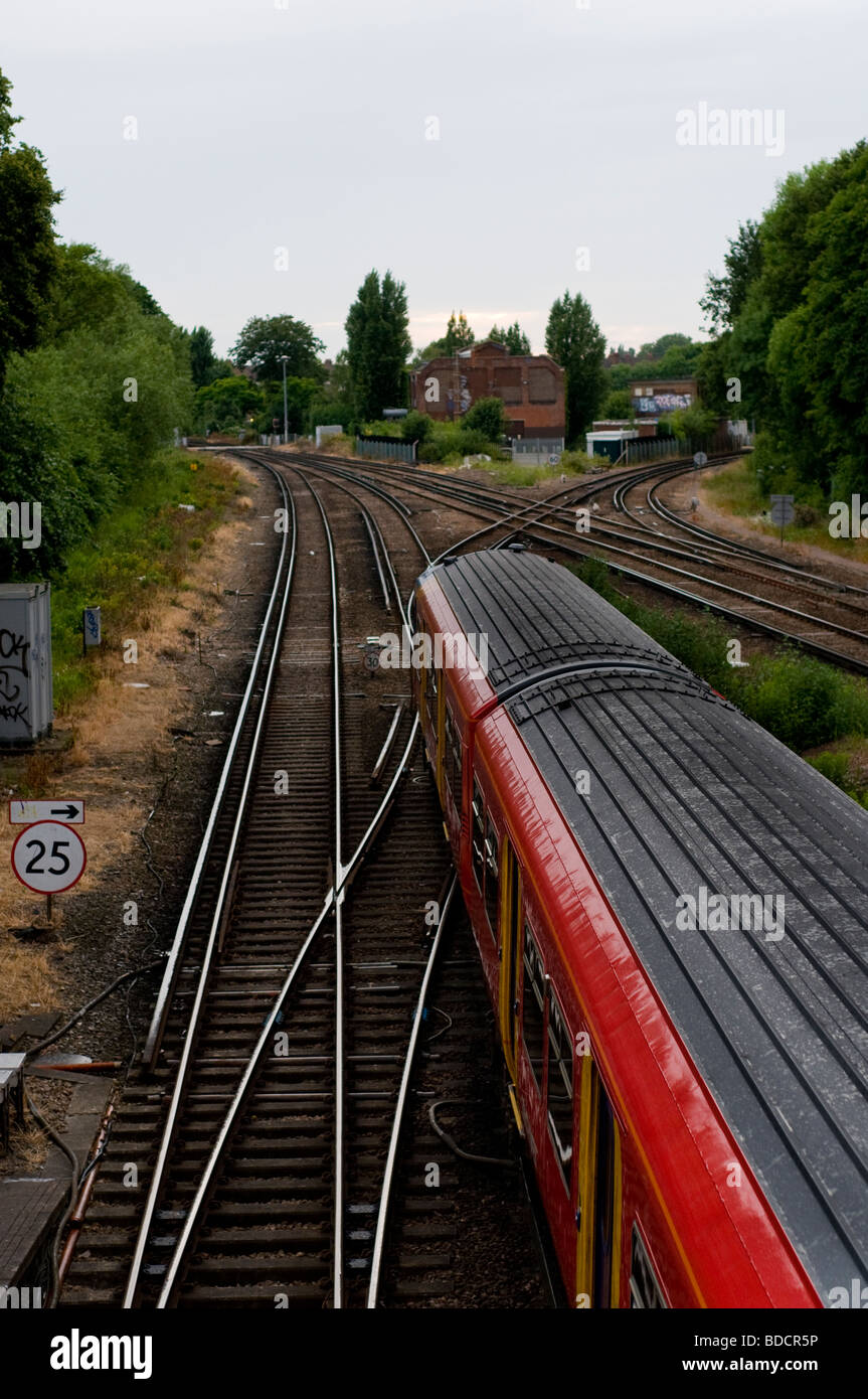 Train leaving the station, with tracks off into the distance Stock ...