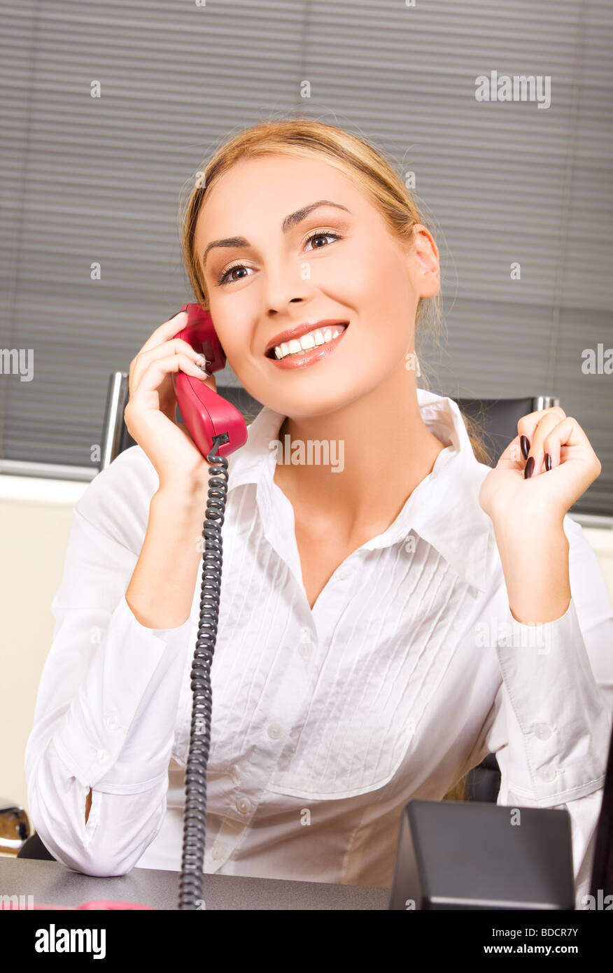 picture of lovely girl with phone in office Stock Photo - Alamy