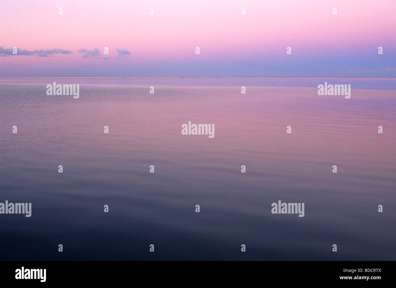 Sunset over the ocean from the Island of Moorea, Tahiti, French ...