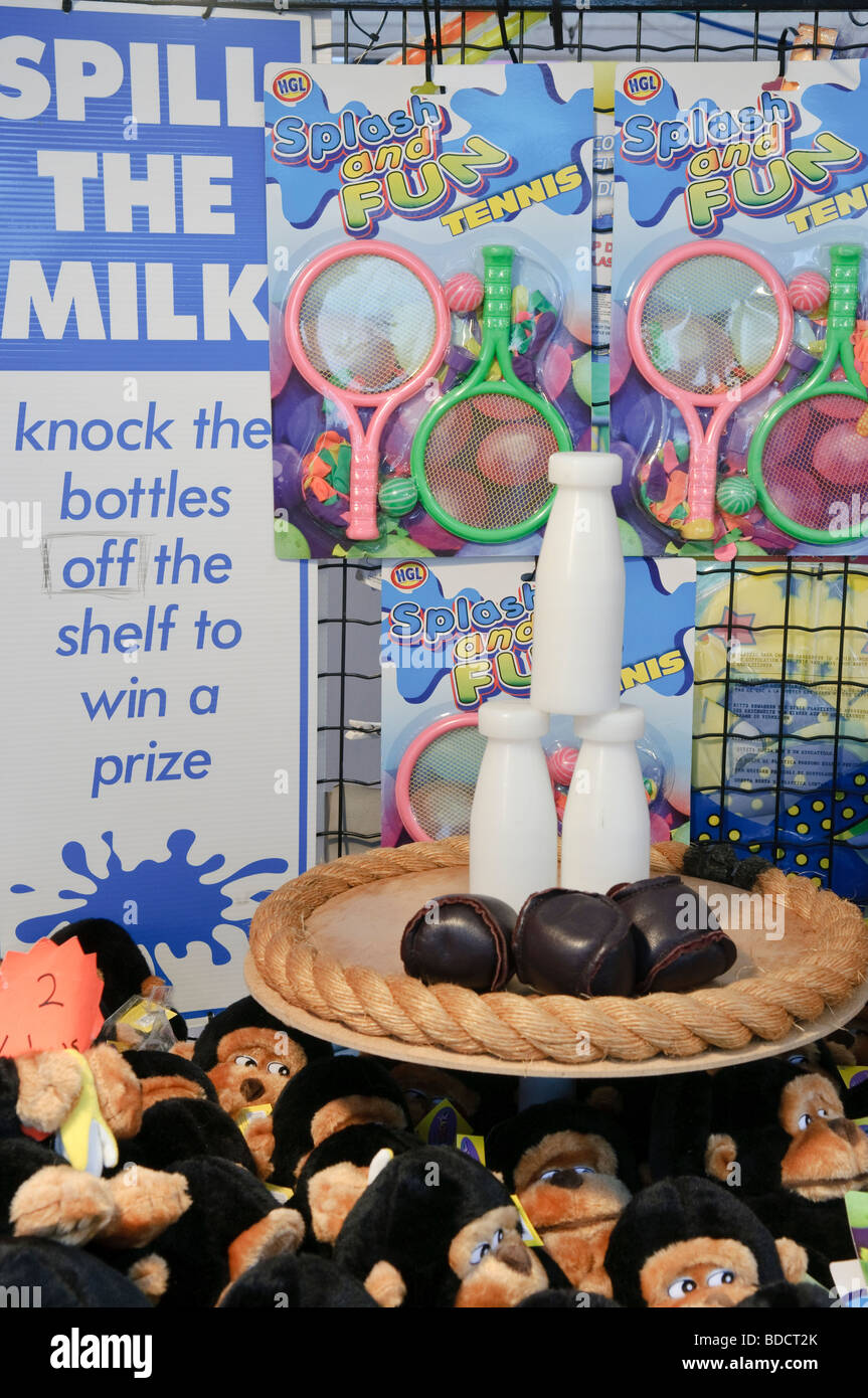 Fairground stall "Spill the Milk - knock the bottles off the shelf to ...
