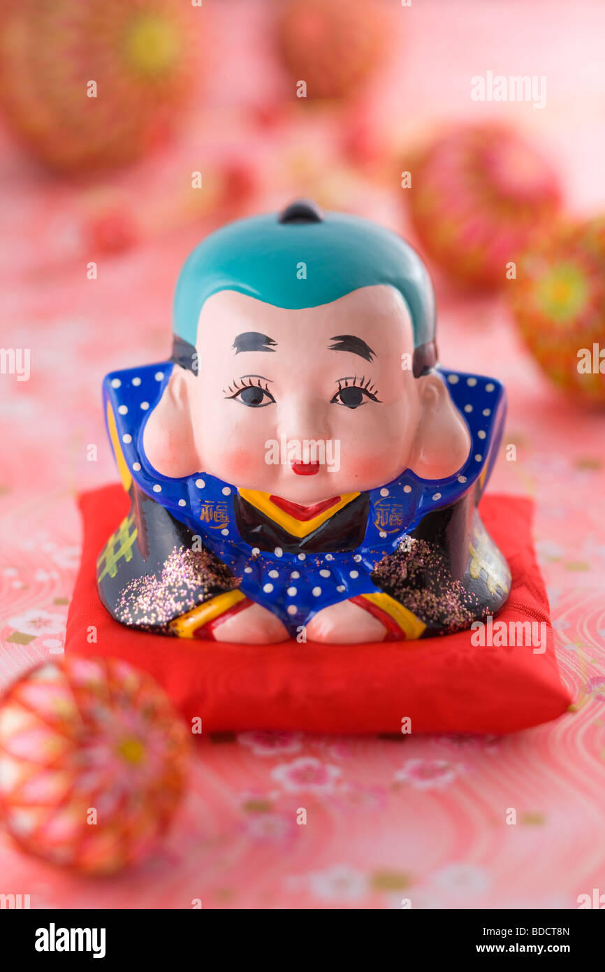 Fukusuke doll and temari ball Stock Photo - Alamy