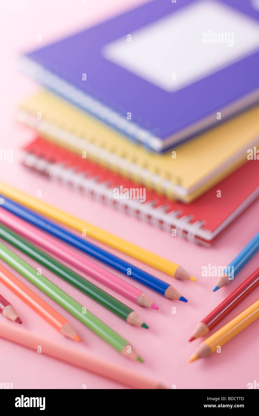 Notebook and colored pencil Stock Photo - Alamy