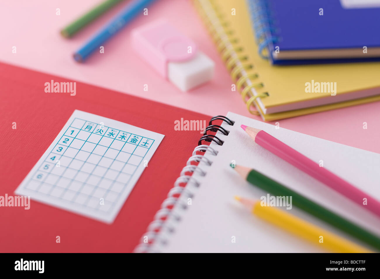 Notebook and colored pencil Stock Photo - Alamy