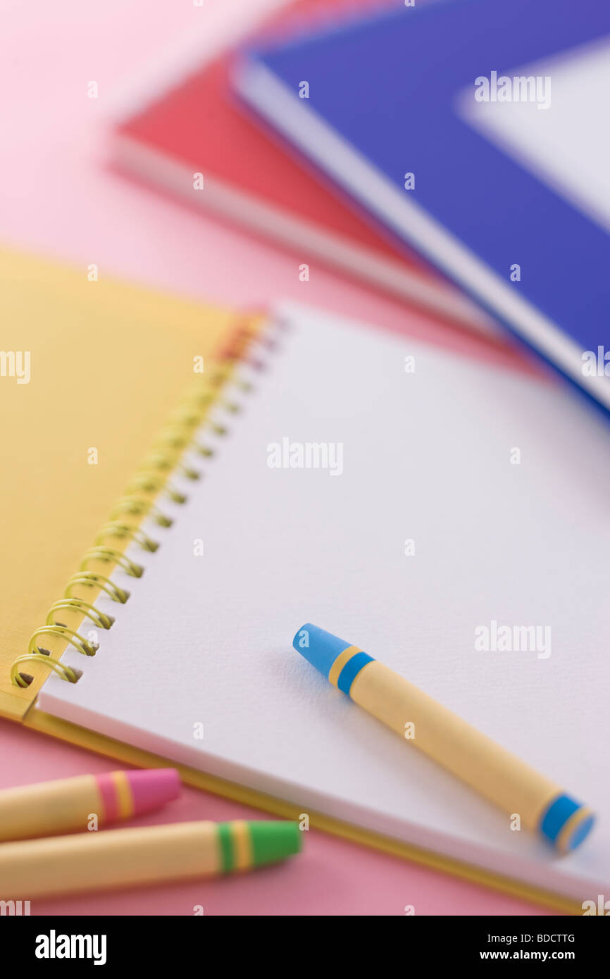 Notebook and crayon Stock Photo - Alamy