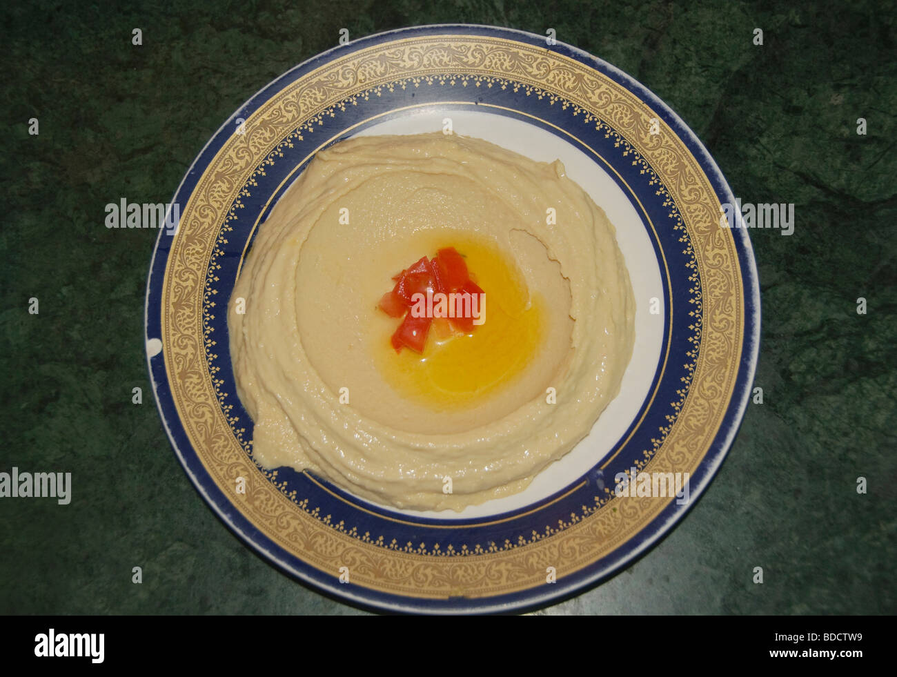 plate of hummus in middle eastern restaurant Stock Photo - Alamy