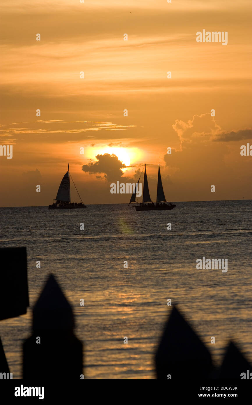 Boats passing through Key West sunset Stock Photo - Alamy